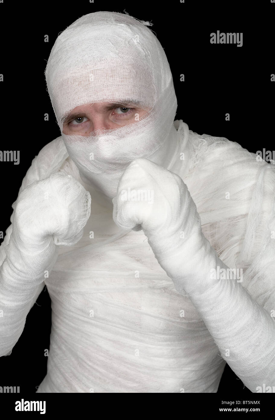 Man in bandage on the black background Stock Photo - Alamy