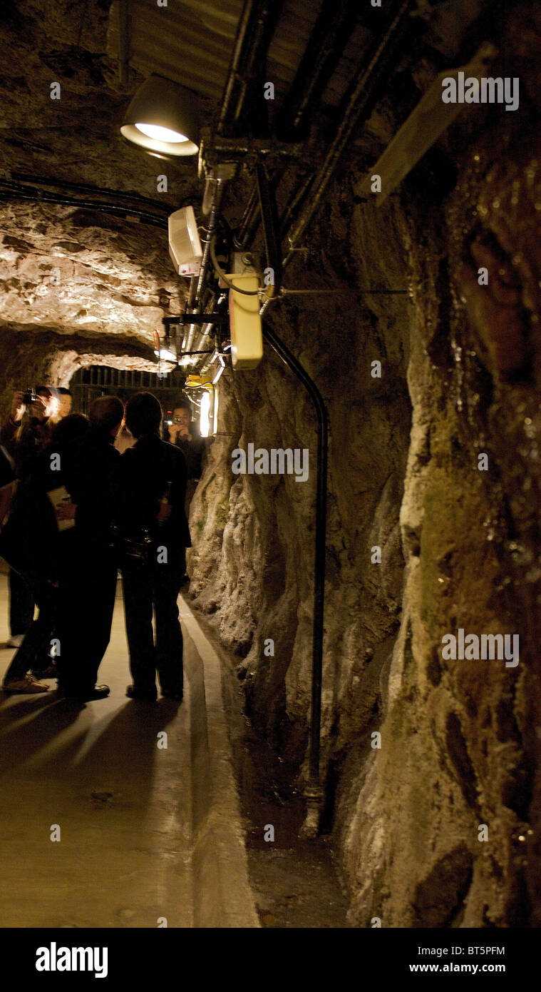 People in an underground tunnel have their picture taken during a tour ...