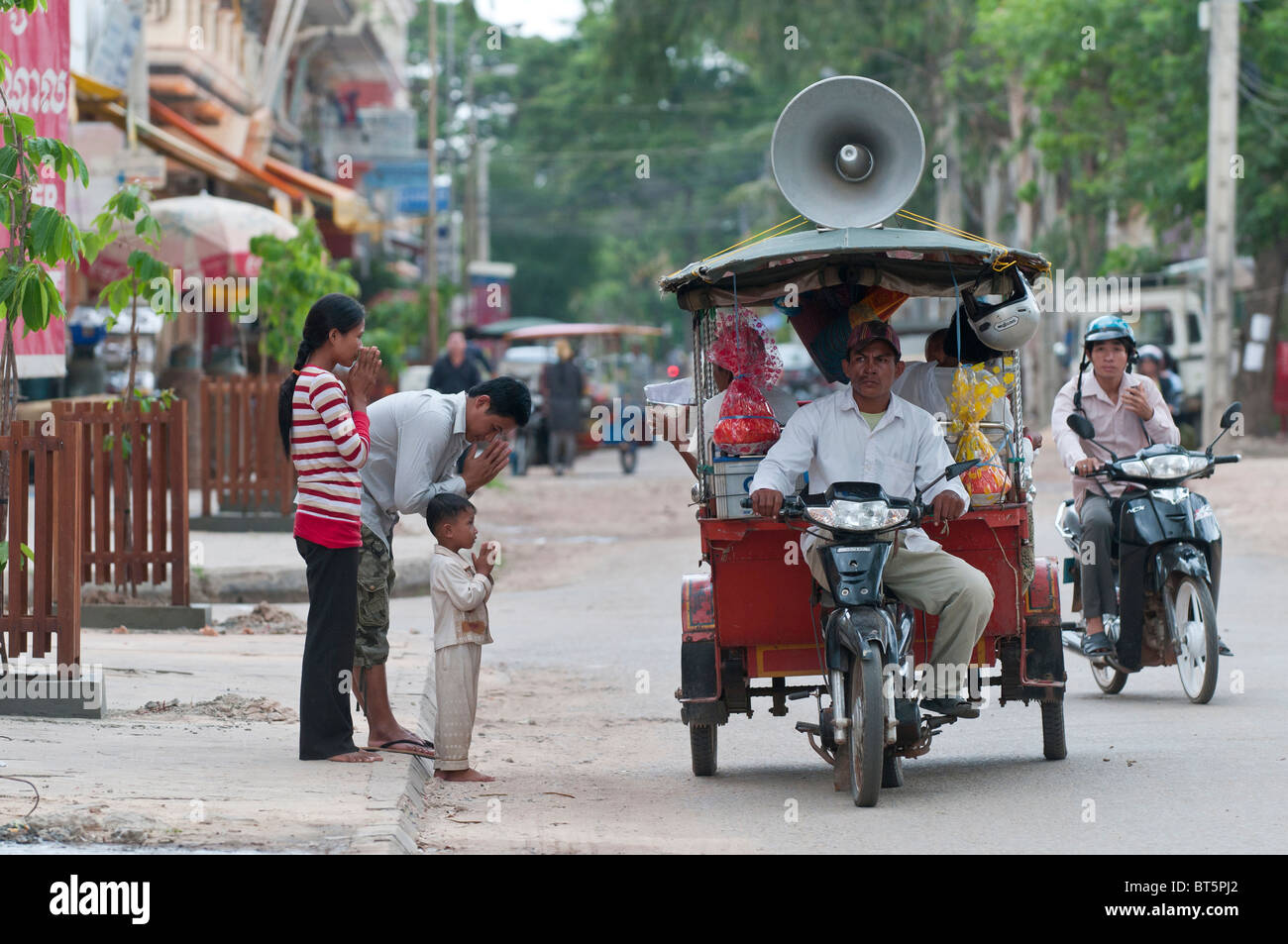A Mobile Buddhist Nun offers Blessings to Passes By From an Auto ...