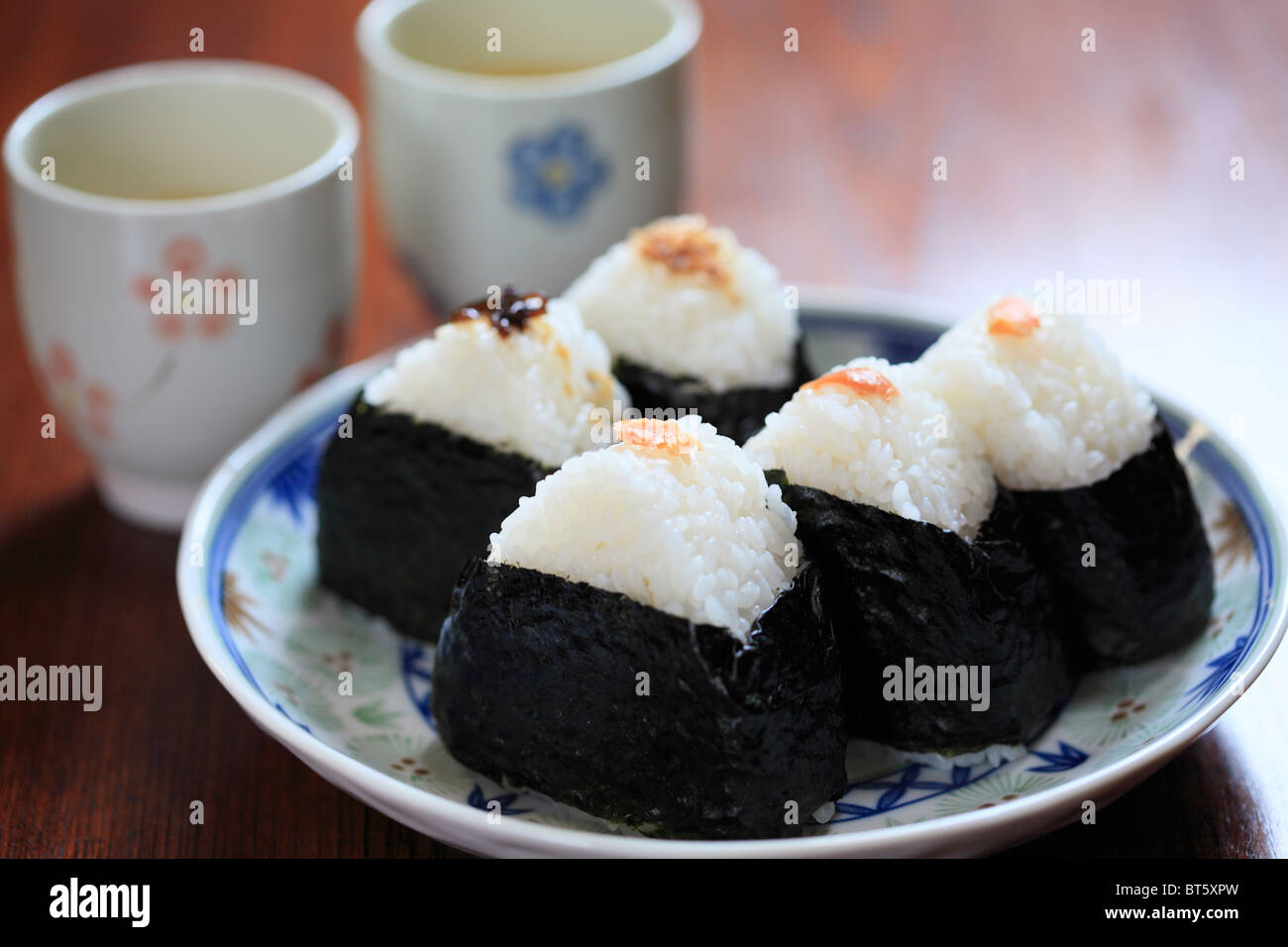 Rice ball and green tea Stock Photo - Alamy