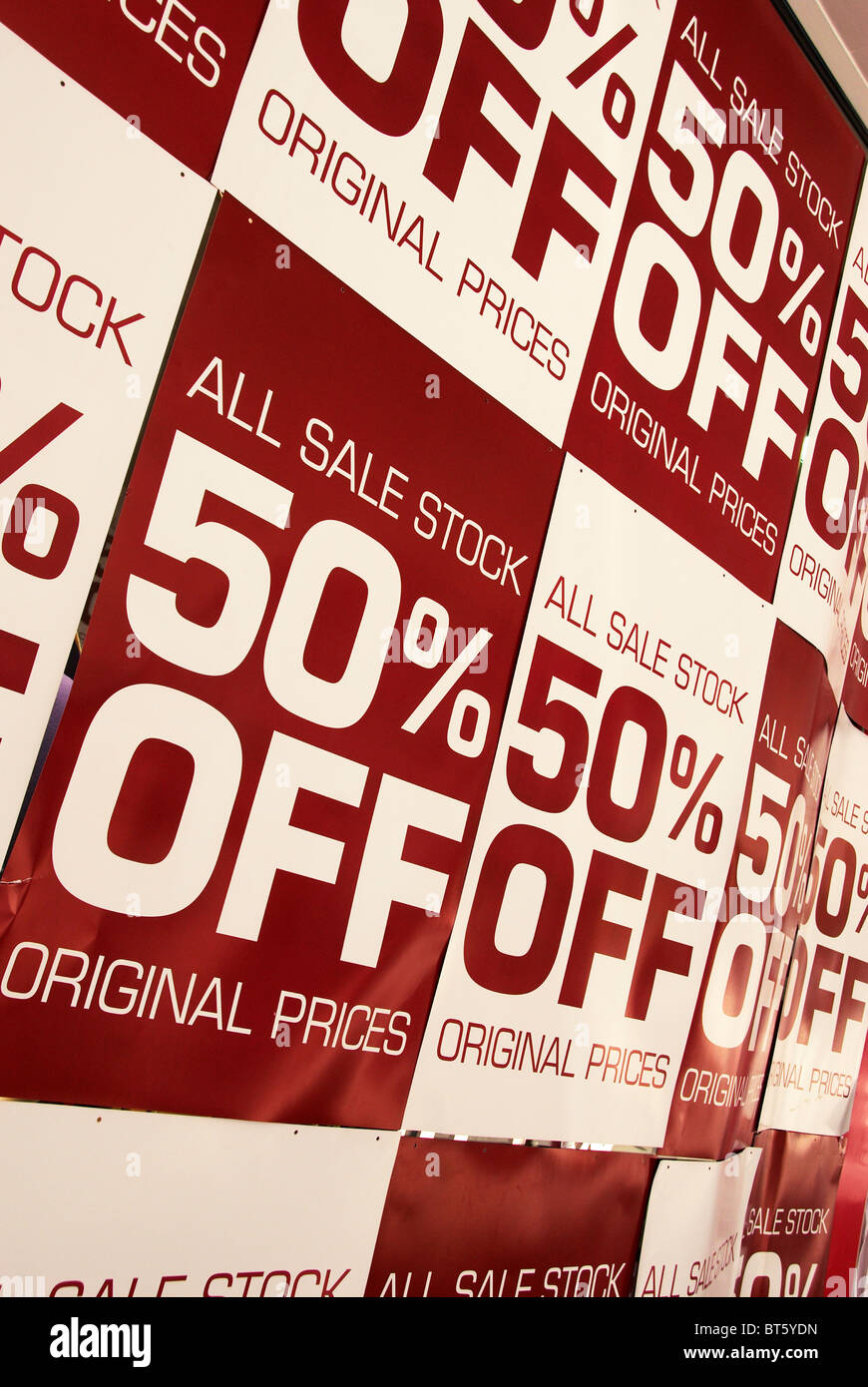 50% off red and white signs on shop window Stock Photo - Alamy