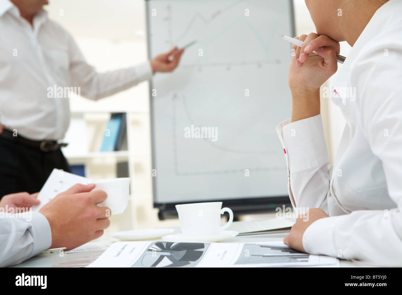 Photo of human hands over workplace on background of teacher by the ...