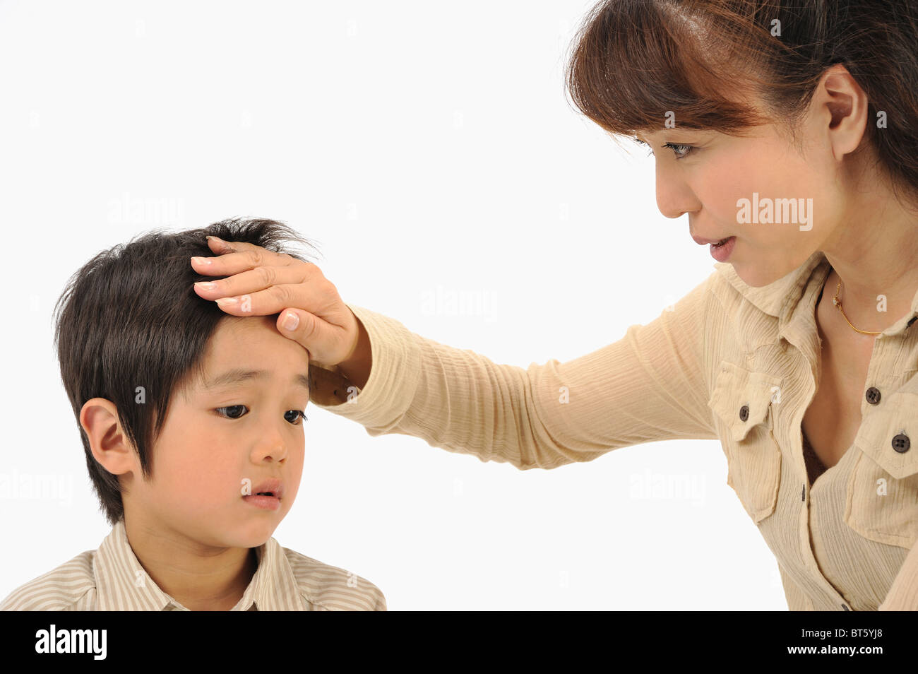 Mother touching son's forehead Stock Photo - Alamy