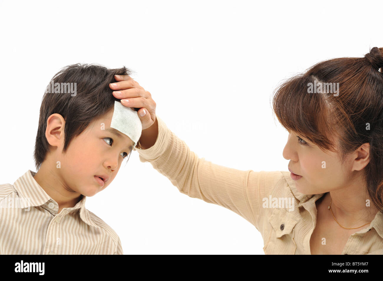 Woman touching forehead checking hi-res stock photography and images ...