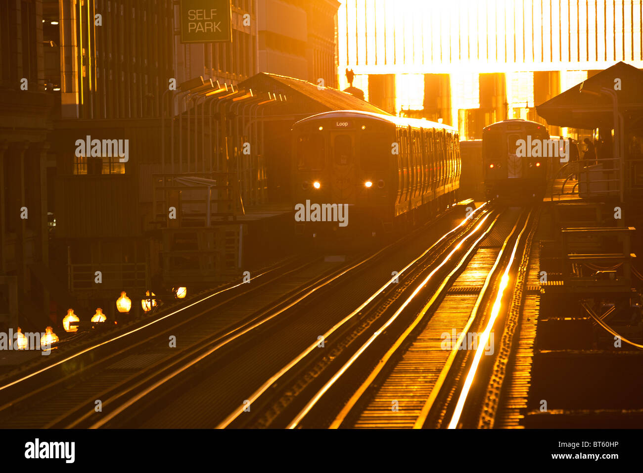 Sunrise illuminates the elevated tracks of the Chicago rapid transit ...