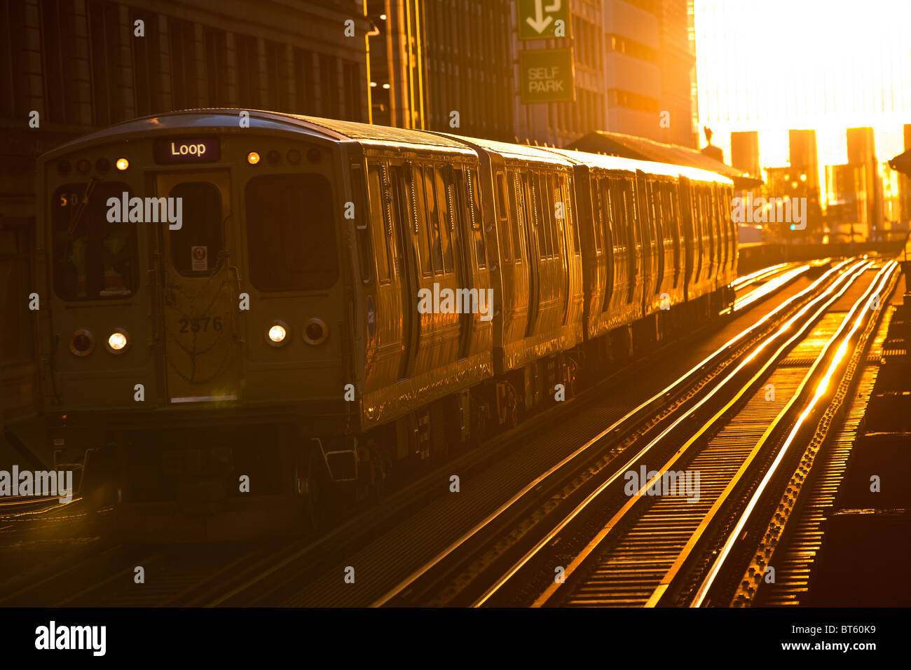 Sunrise illuminates the elevated tracks of the Chicago rapid transit ...