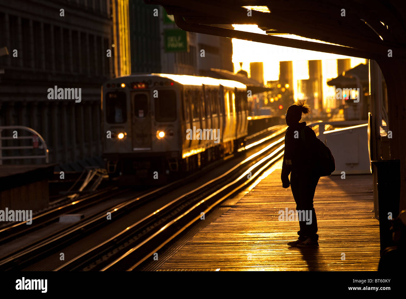 Sunrise illuminates the elevated tracks of the Chicago rapid transit ...