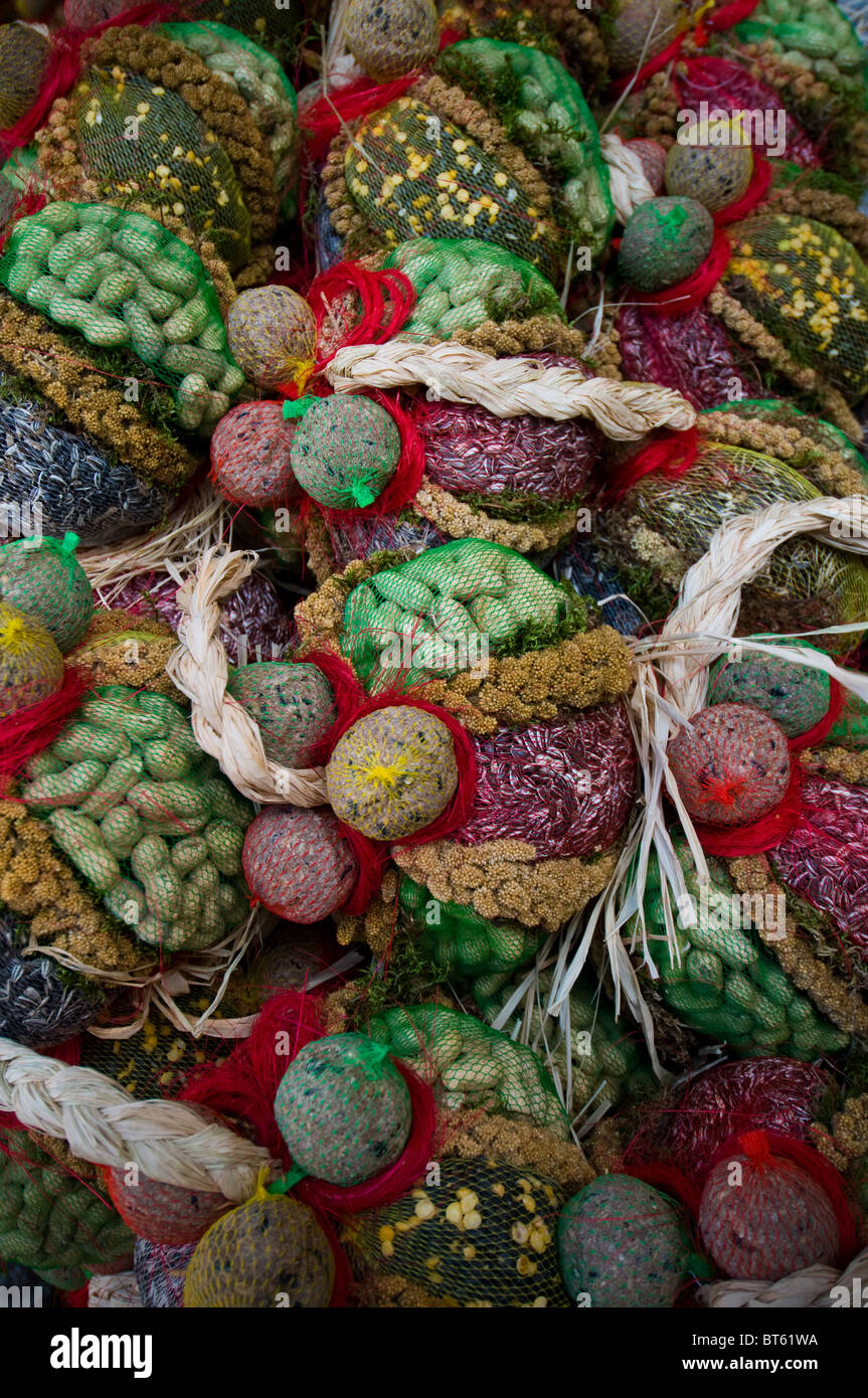 bird food feeder netting bag nut nuts peanut fat ball Stock Photo - Alamy