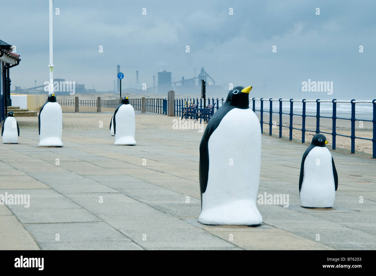 penguin figures on promenade, Redcar Cleveland UK steel works in ...