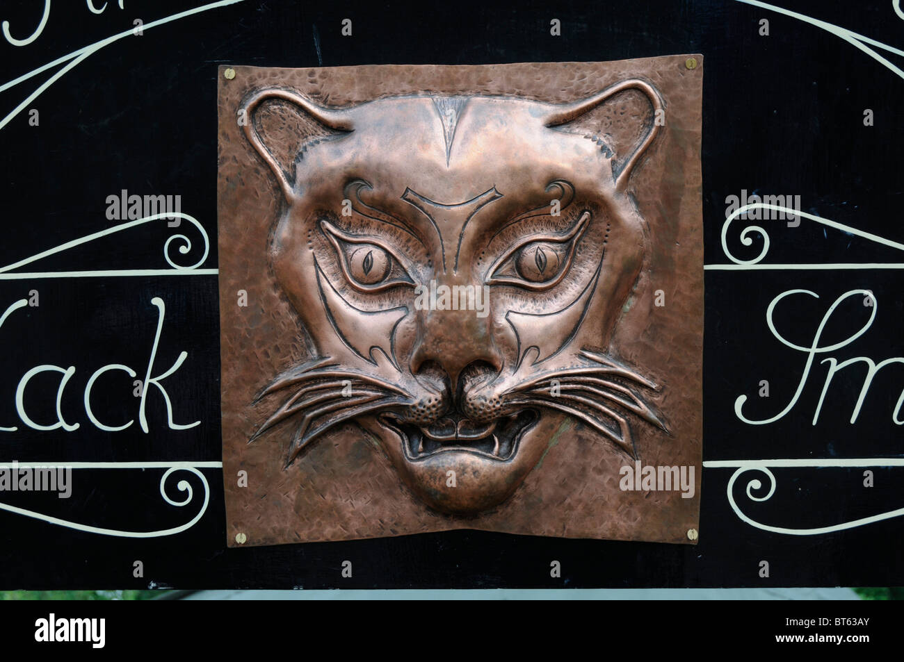 beaten copper cat feline tiger sculpture Stock Photo - Alamy