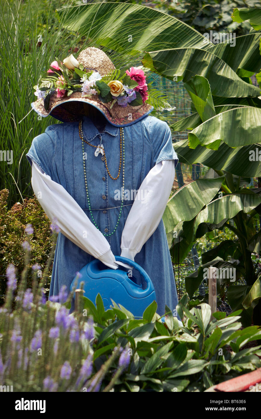 A lady scarecrow in a suburban garden Stock Photo - Alamy