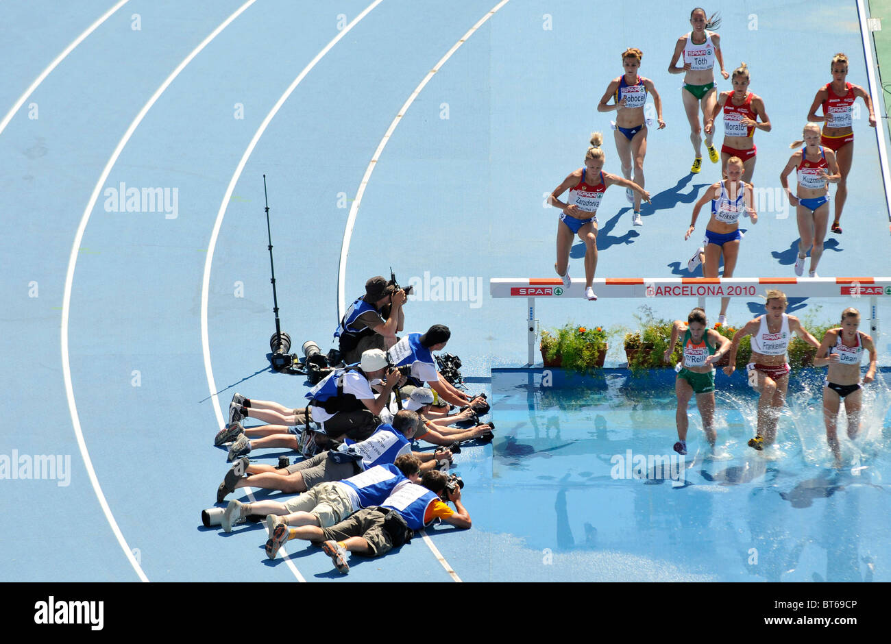 photographers get low position to capture the participants of a female ...
