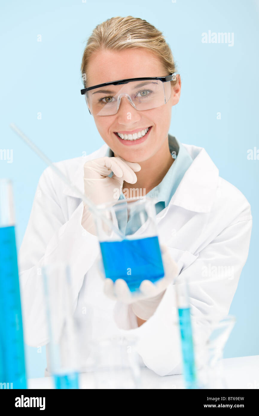 Flu virus experiment - scientist in laboratory wear protective eyewear ...