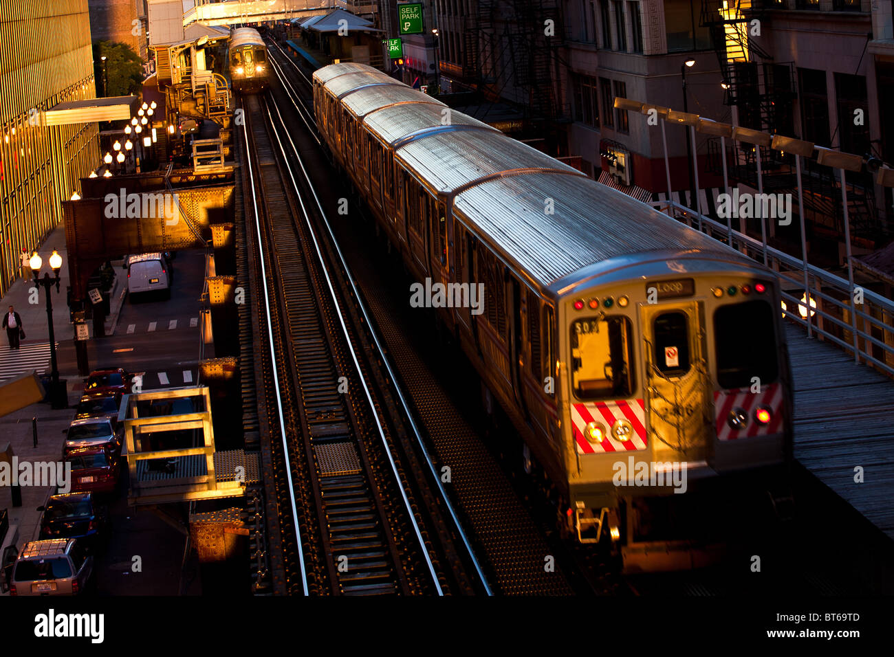 Sunrise illuminates the elevated tracks of the Chicago rapid transit ...