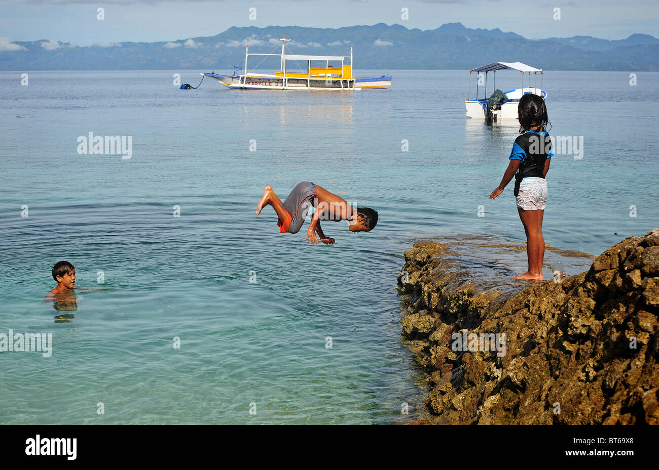 Filipino Kids Playing in Ocean Moalboal Cebu Province Philippines Stock ...