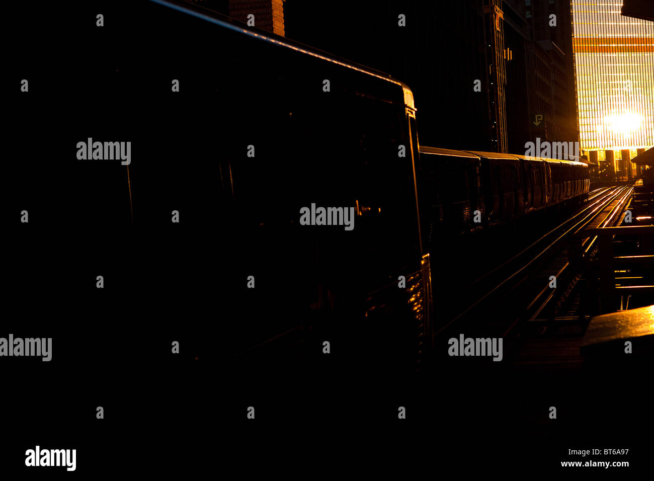 Sunrise illuminates the elevated tracks of the Chicago rapid transit ...