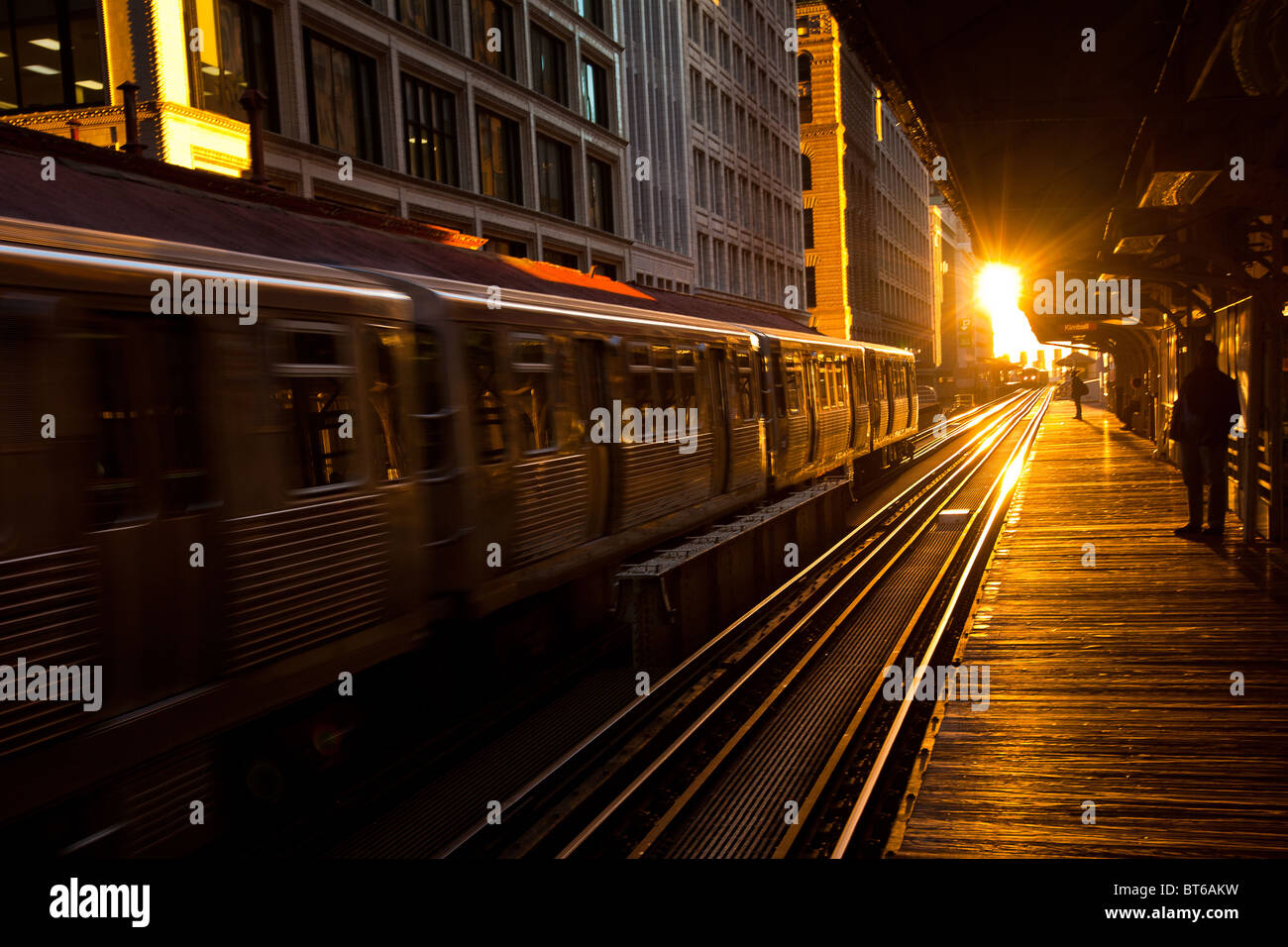 Sunrise illuminates the elevated tracks of the Chicago rapid transit ...