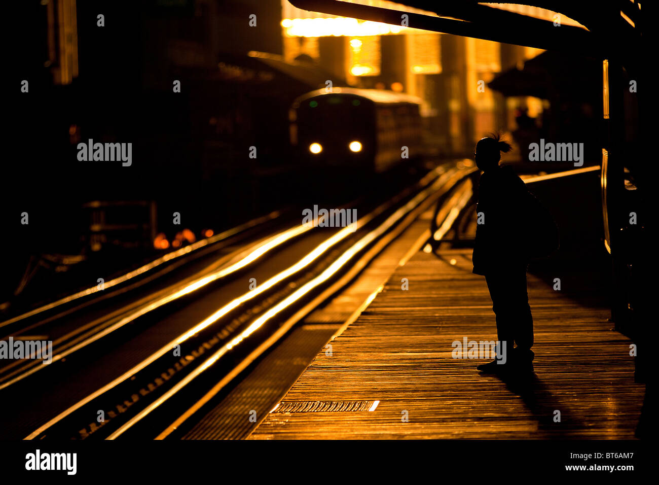 Sunrise illuminates the elevated tracks of the Chicago rapid transit ...