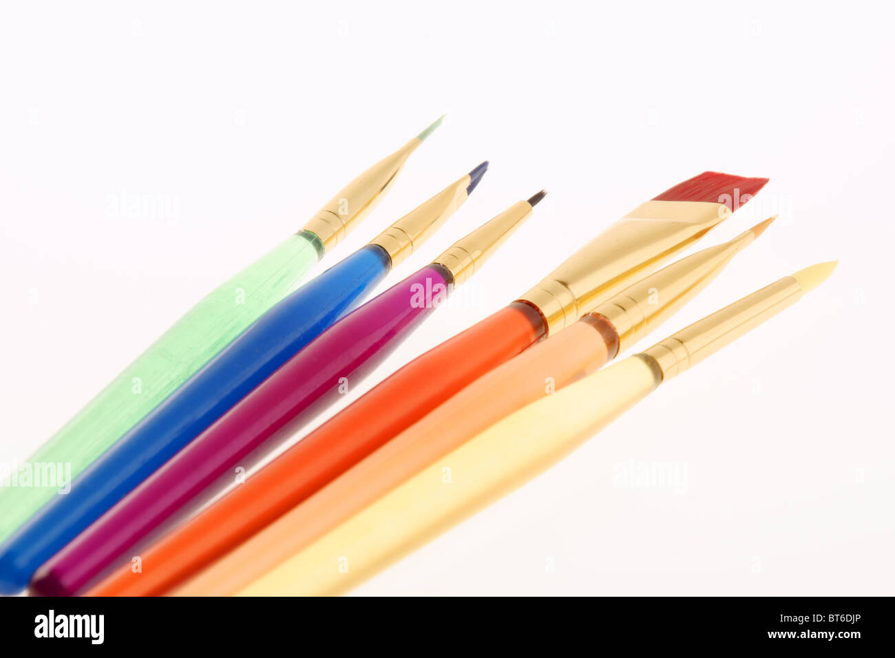 Set of colored brushes isolated on white Stock Photo - Alamy