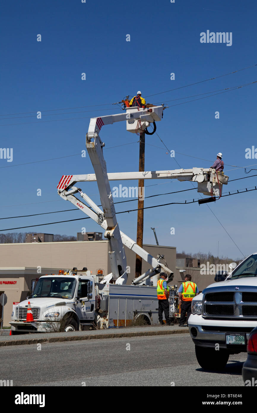 Utility workers in hydraulic lift telescope bucket truck working on ...