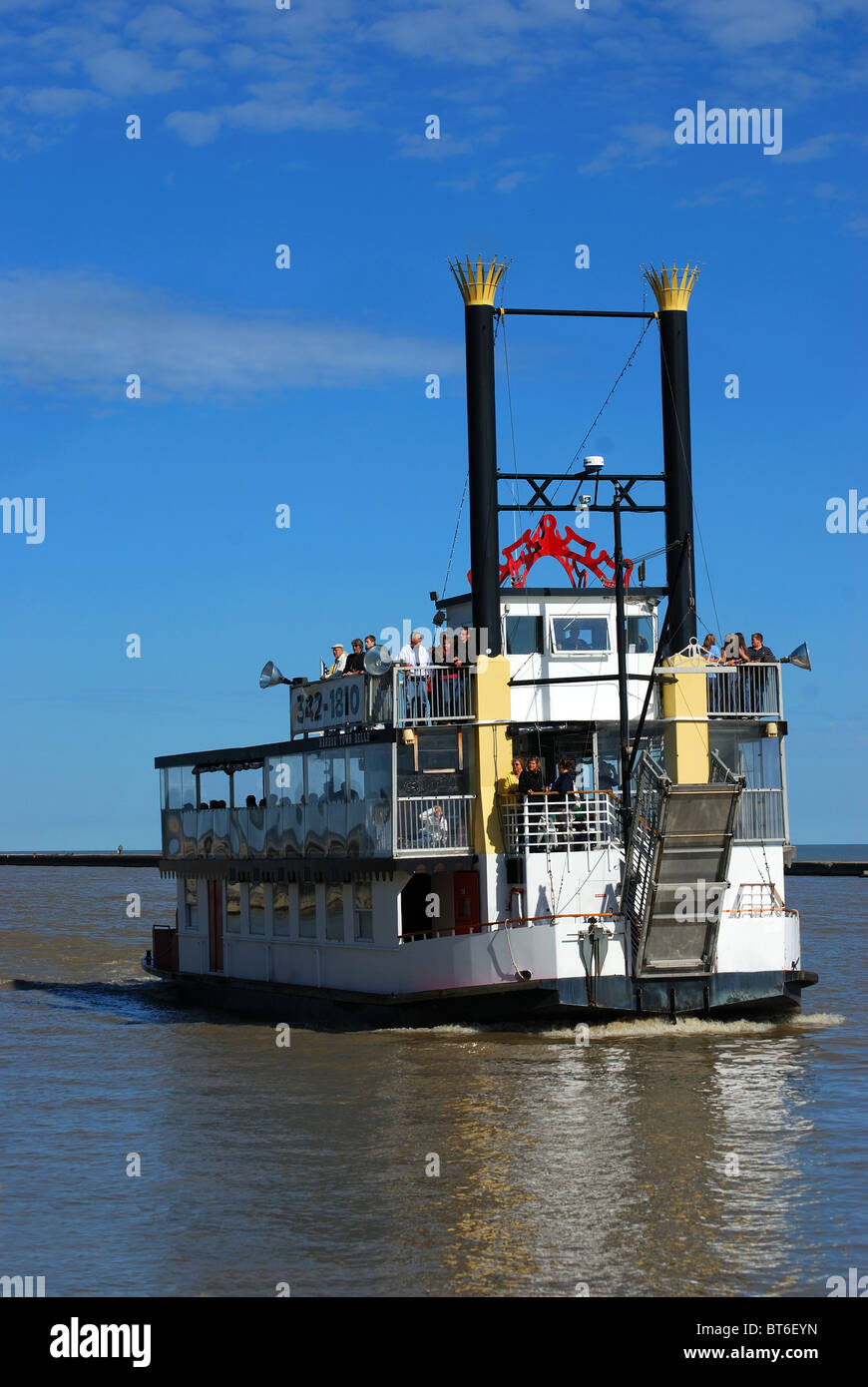 Tourists take paddle boat ride on the Harbor Town Belle up the Genesee ...