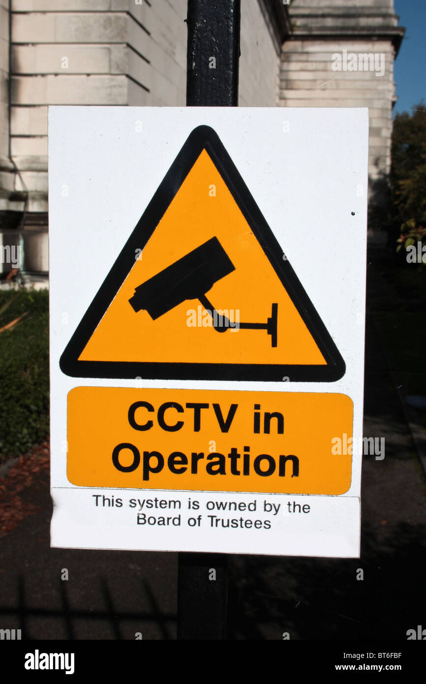 UK yellow CCTV warning sign Stock Photo - Alamy