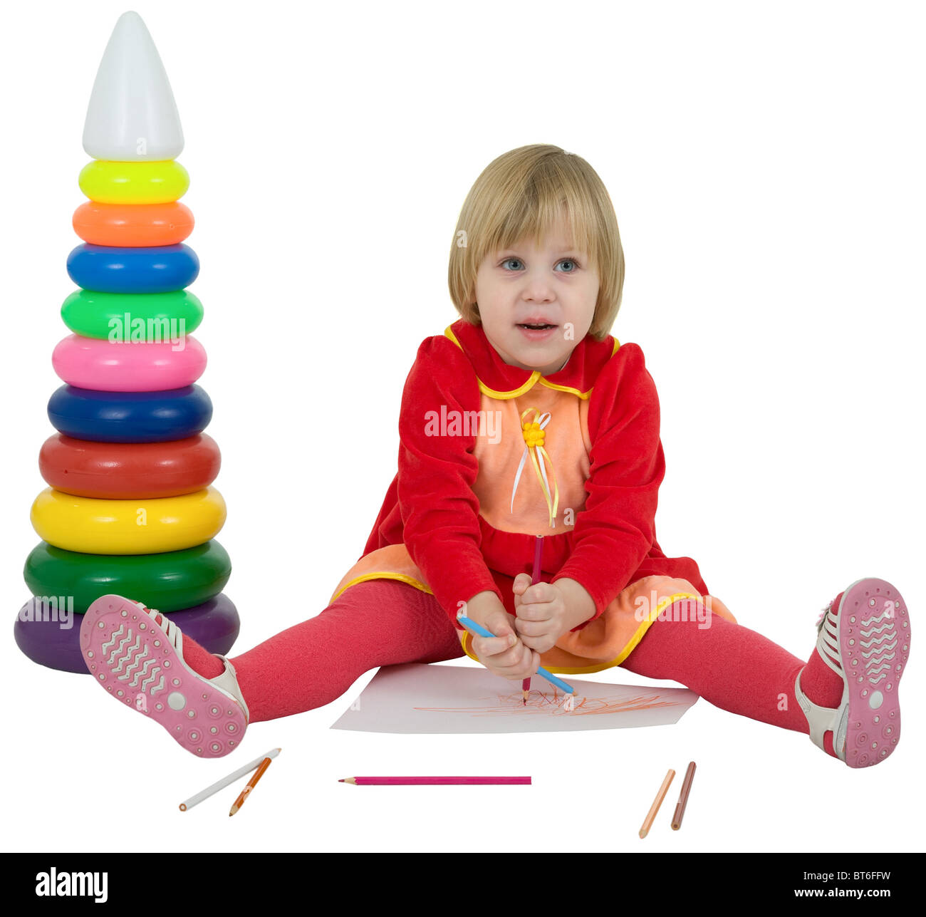 Little girl and toy plastic pyramid and crayons Stock Photo - Alamy
