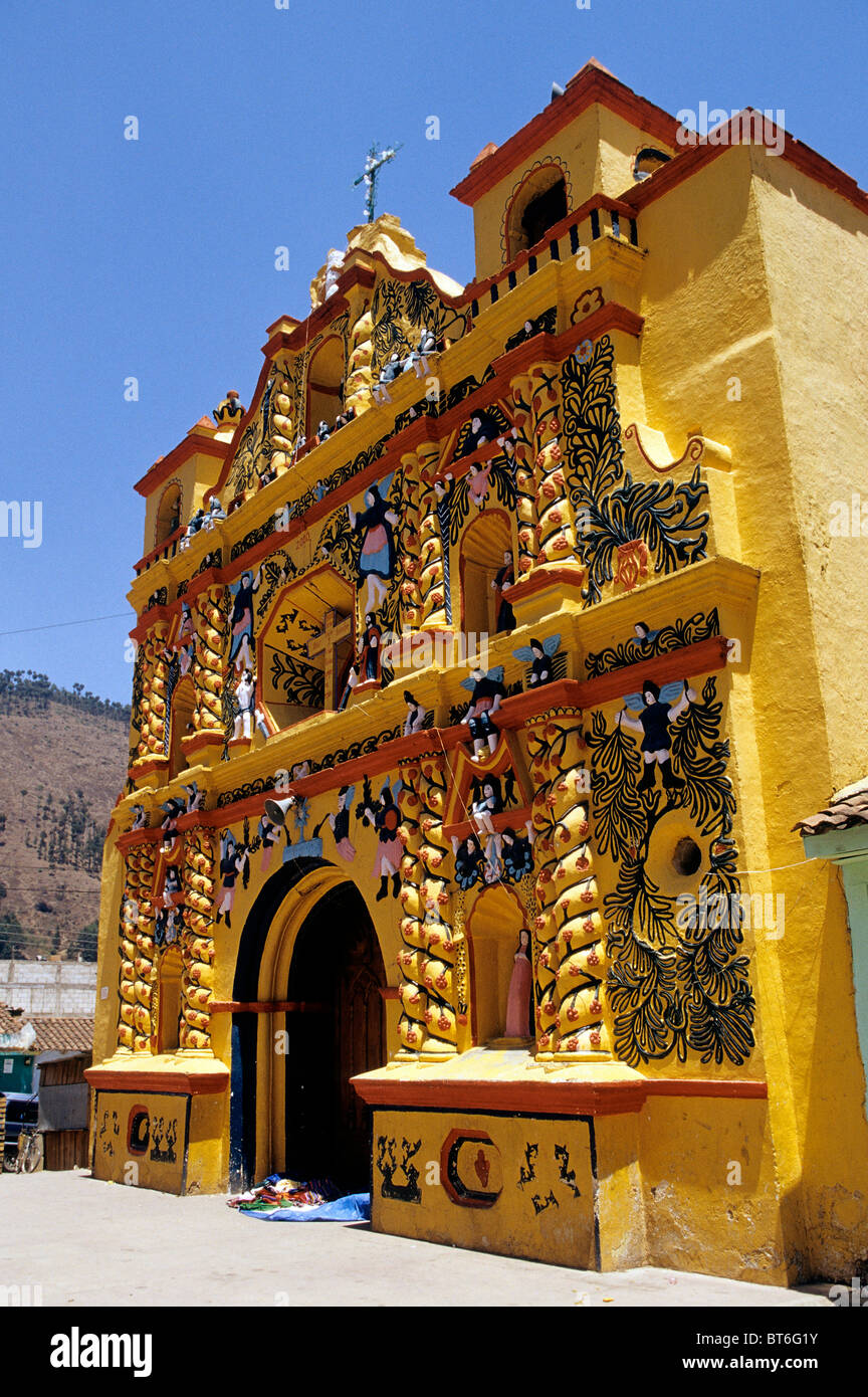 Exterior of the multi colored church in the village of San Andres Xecul ...
