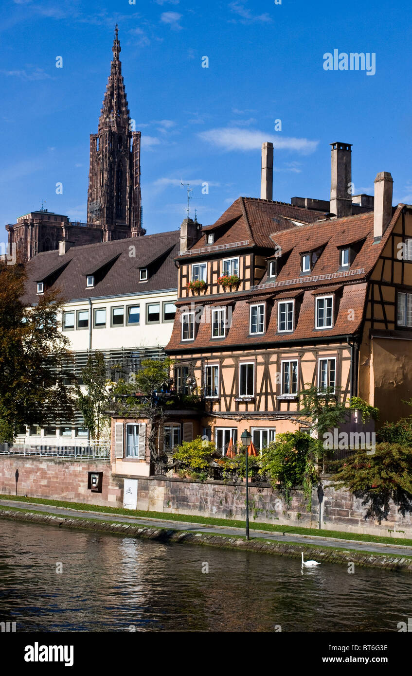 canal view with background gothic cathedral spire, Strasbourg, Alsace ...