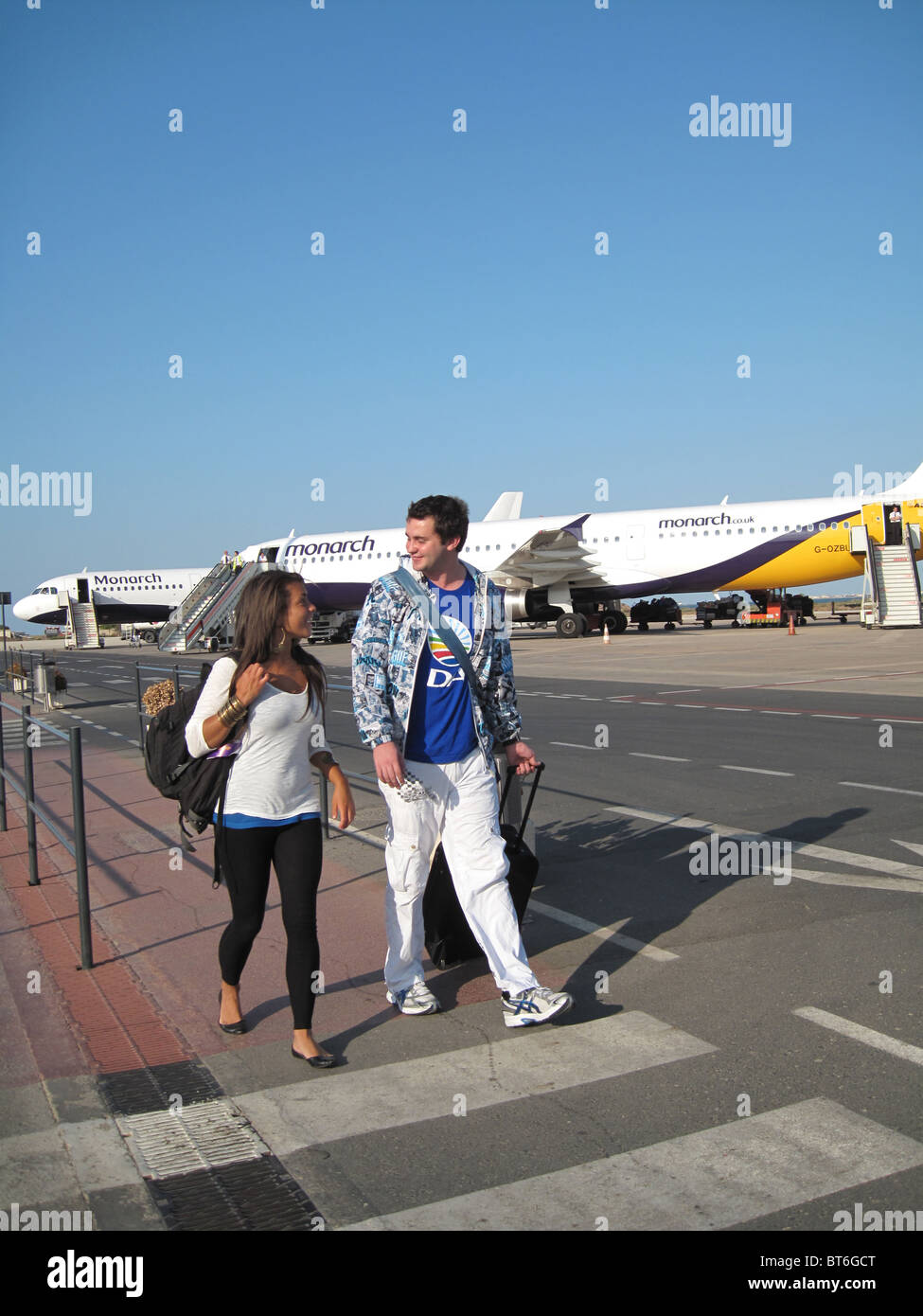 Tourists getting off plane hi-res stock photography and images - Alamy