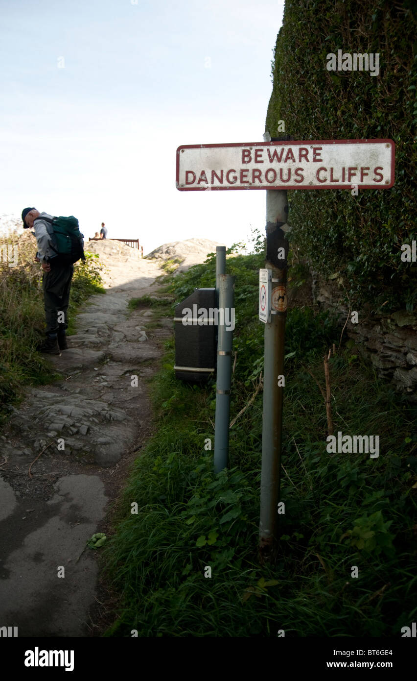 Beware Dangerous cliffs sign on a coastal path in Polperro, Cornwall ...
