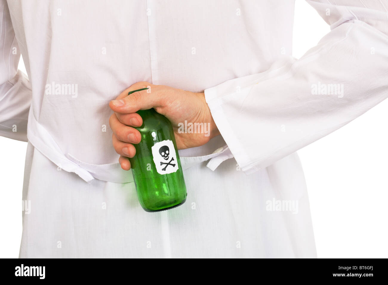 Hand in white overall with green bottle of poison on a white background ...