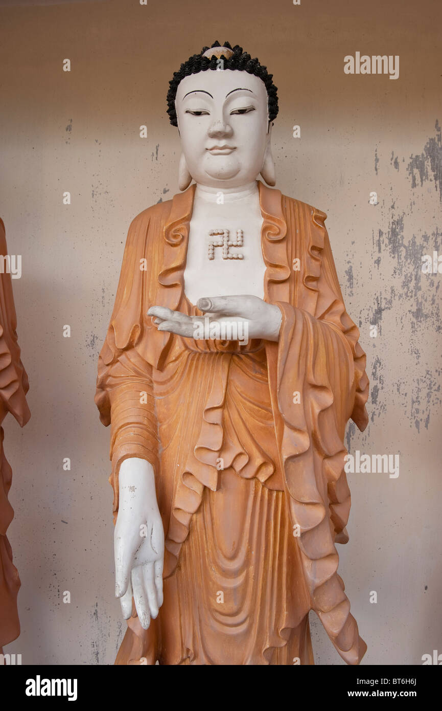 Statue of Buddha with Buddhist Swastika in Kek Lok Si Temple in Penang ...