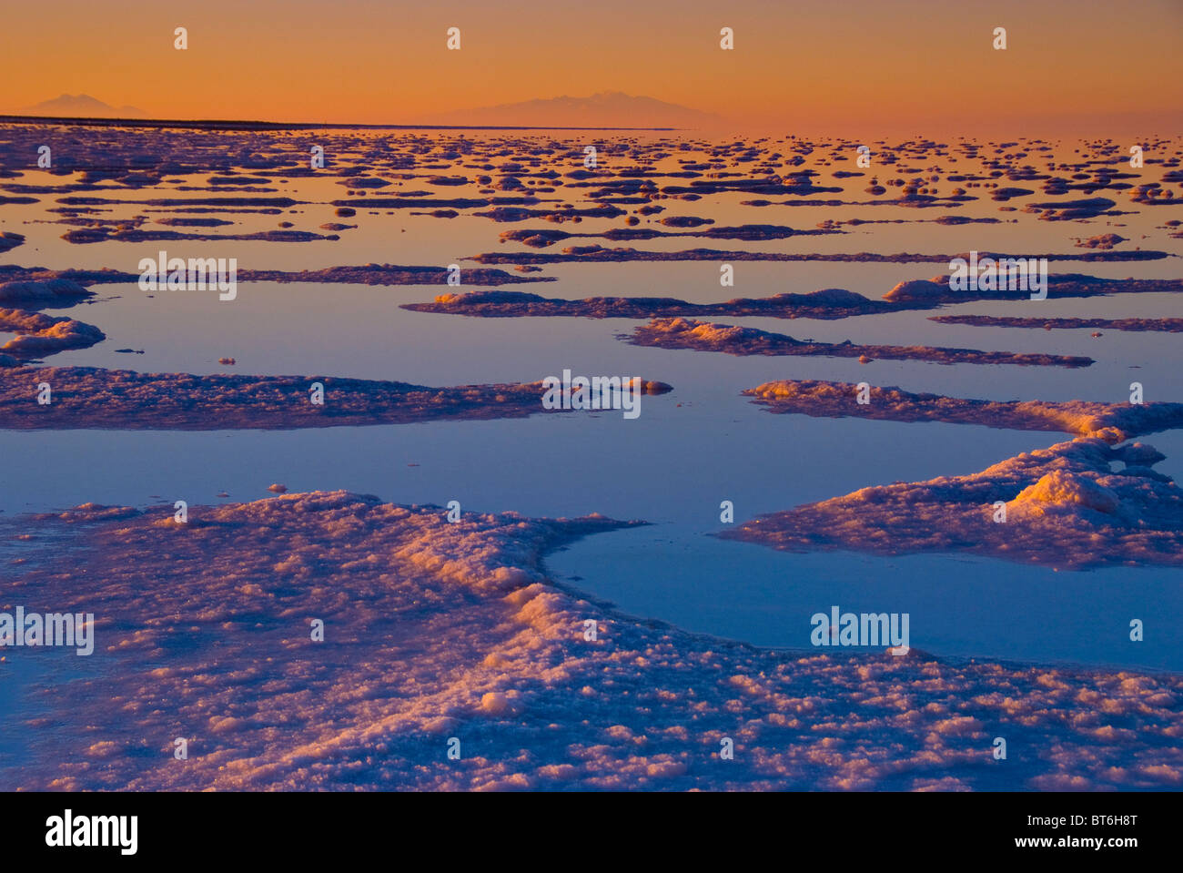 Salt formations, Wind and water carved shore formations at sunrise ...