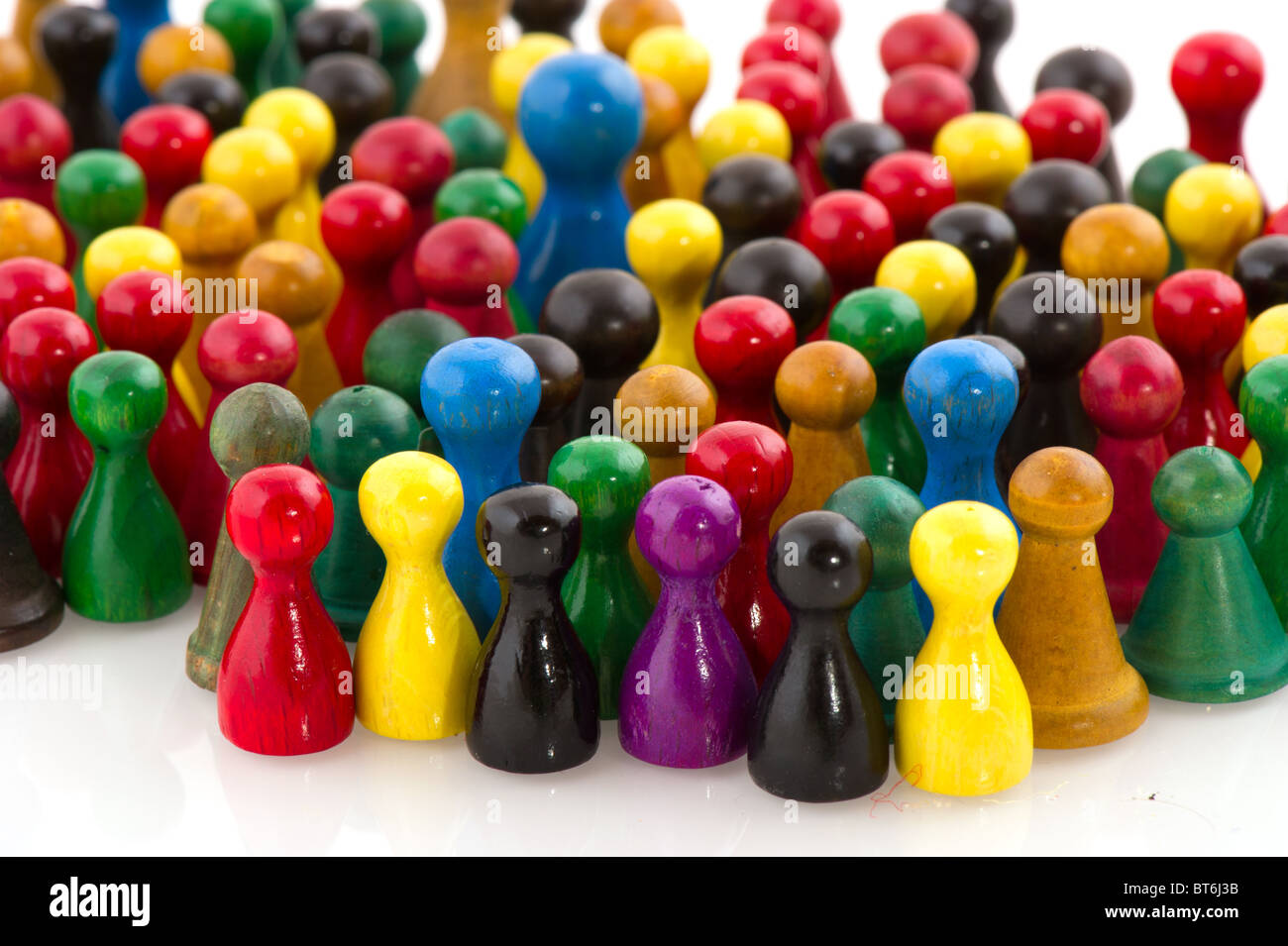Many colorful pawns as a crowd on white Stock Photo - Alamy