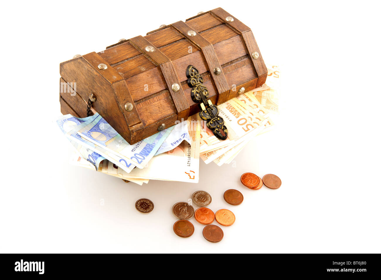 wooden money box with many euro isolated over white Stock Photo - Alamy