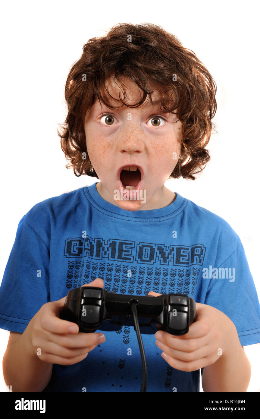 Young boy playing with games controller of console Stock Photo - Alamy
