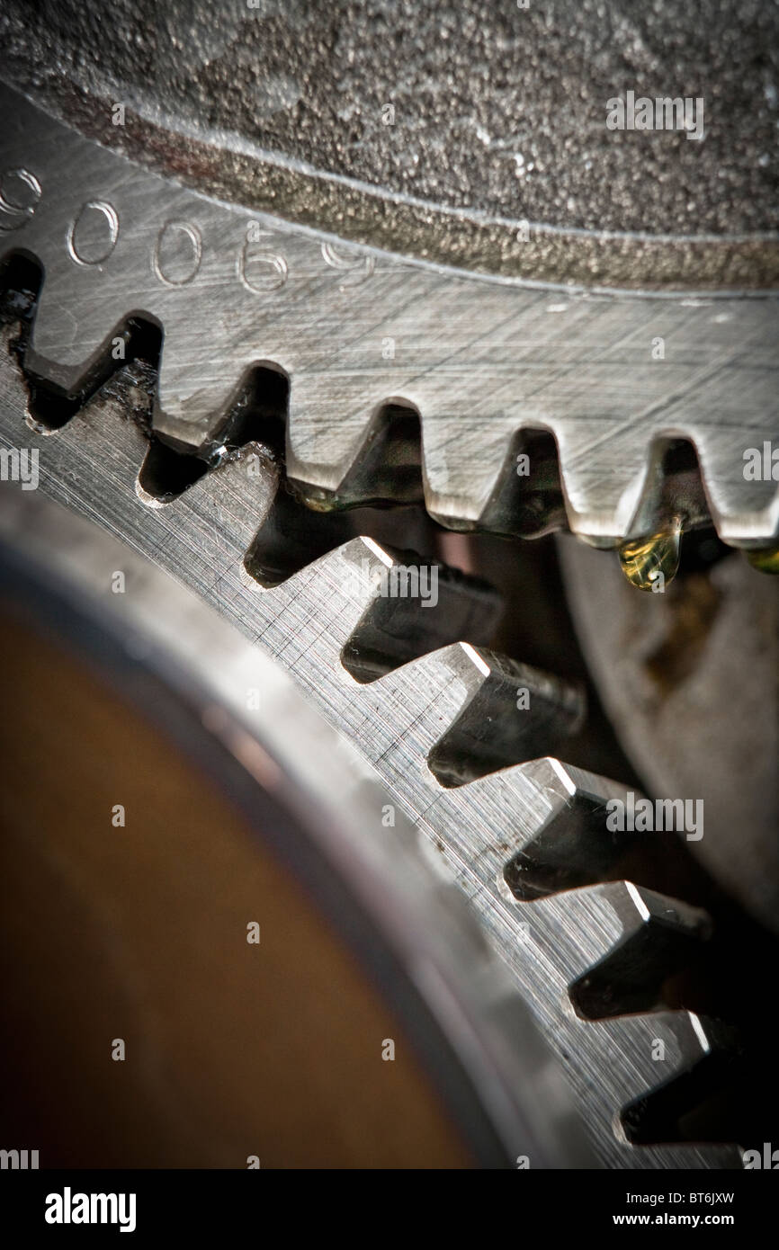 Close up of industrial gears with a drop of oil Stock Photo - Alamy