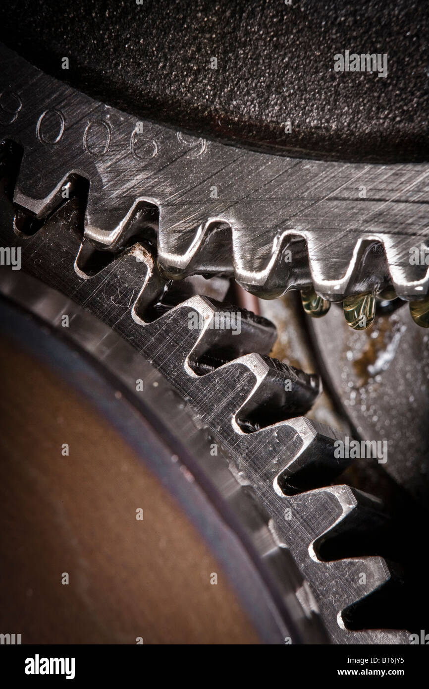 Close up of industrial gears with a drop of oil Stock Photo - Alamy