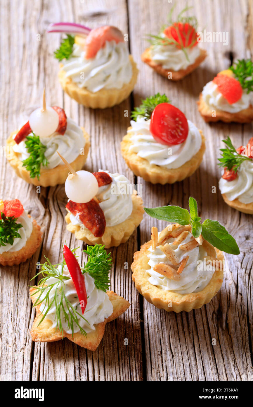 Variety of pastry-based canapes with various toppings Stock Photo - Alamy
