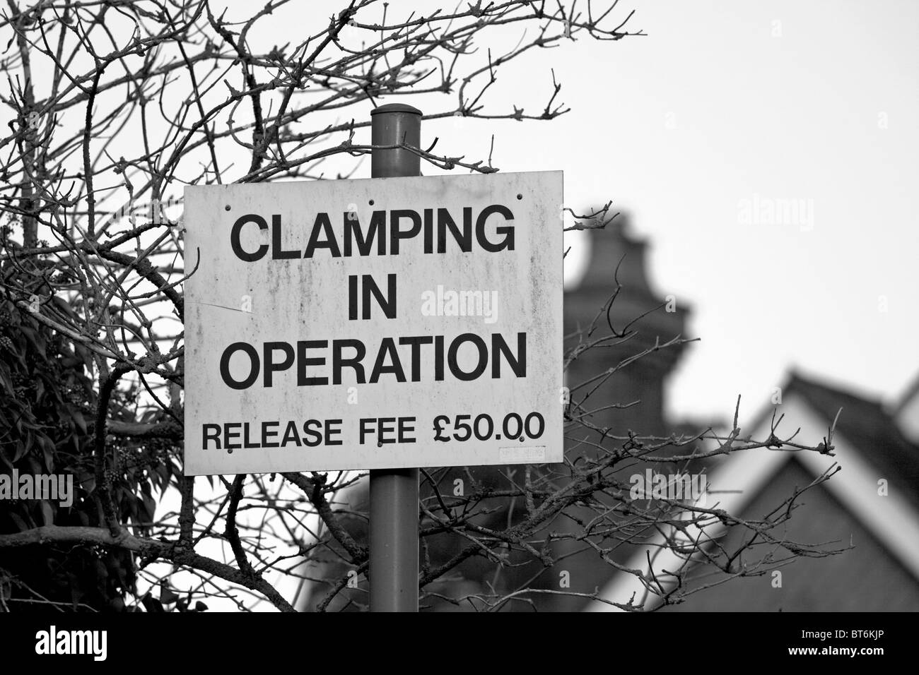 Wheel clamping sign Black and White Stock Photos & Images - Alamy