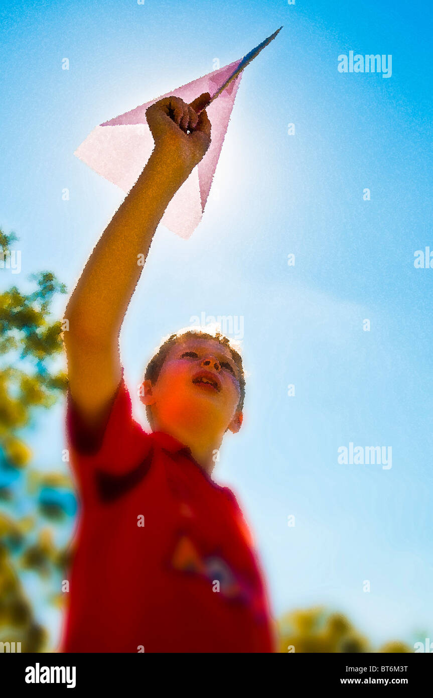 Boy playing with paper airplane Stock Photo - Alamy
