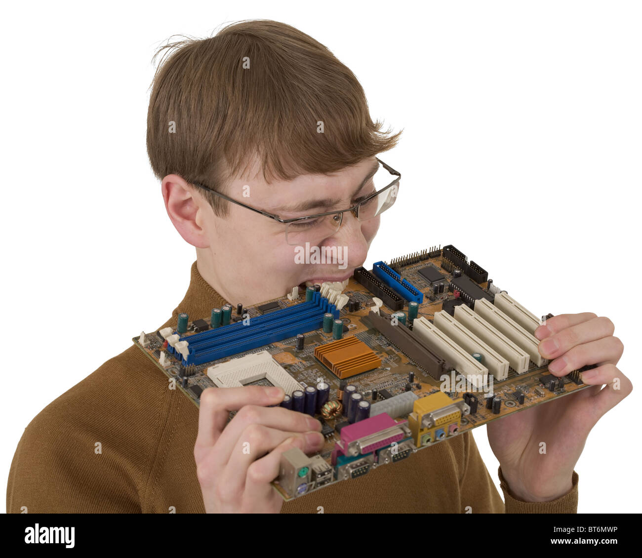 Young man bite motherboard on the white background Stock Photo - Alamy