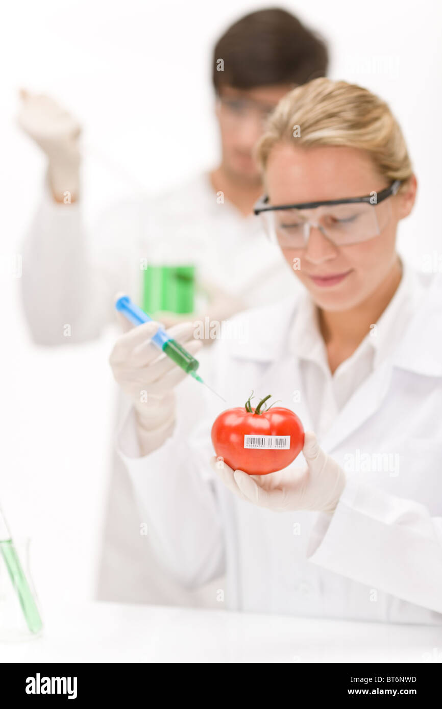 Genetic engineering - scientists in laboratory, GMO testing experiment ...