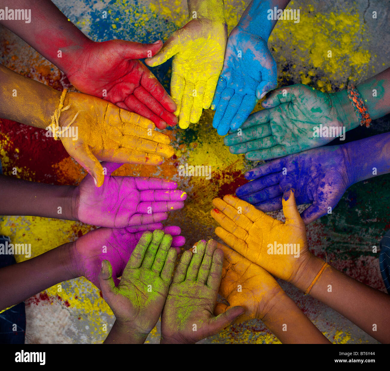 Indian boys multicoloured hands in a circle Stock Photo - Alamy