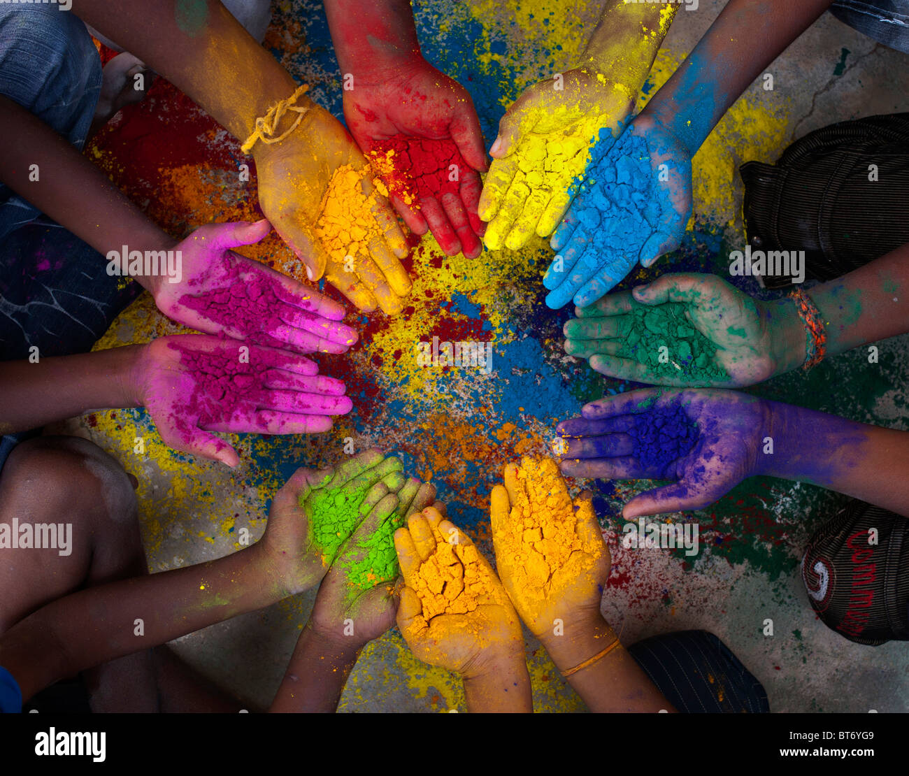 Indian boys multicoloured hands in a circle Stock Photo - Alamy