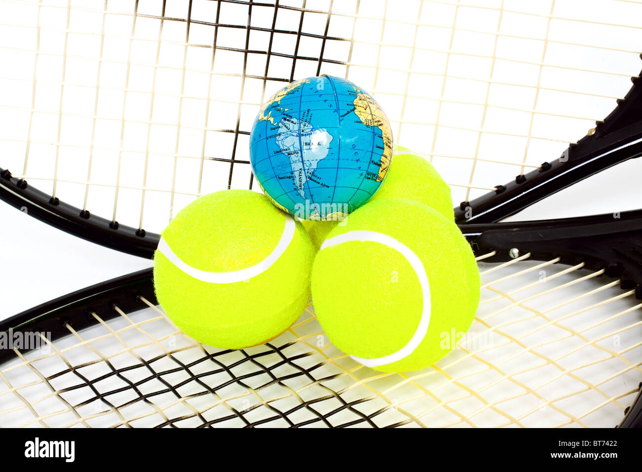 Balls and globe on tennis racket isolated on white background Stock ...