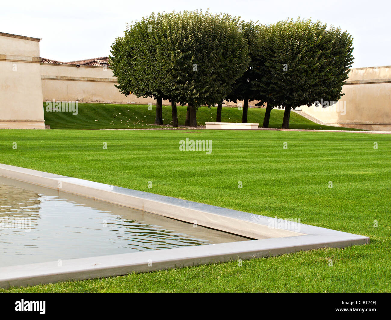 Trees, lawn and pool corner at a French garden Stock Photo - Alamy