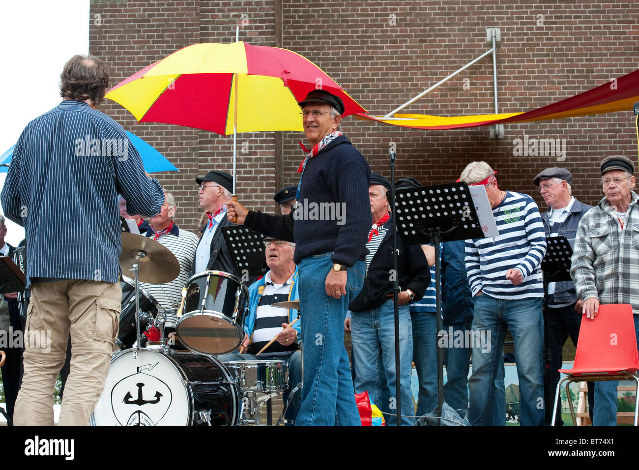 Shanty choir with sailor man singing Stock Photo - Alamy
