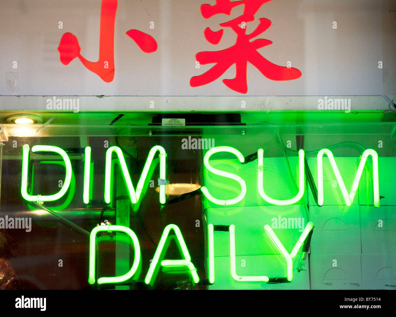 Neon sign in a Chinese restaurant window in London's Chinatown reads ...